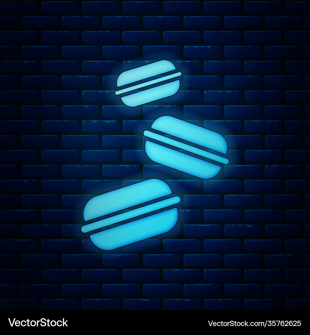 Glowing neon macaron cookie icon isolated on brick
