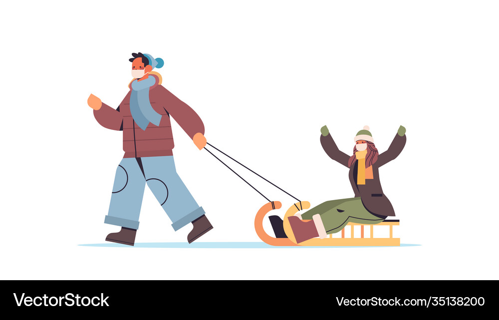 Guy sledding girlfriend happy couple having winter