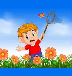 Cute little boy cartoon running to catch butterfly