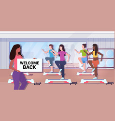 Fitness trainer holding welcome back sign board Vector Image