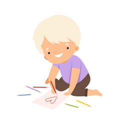 Cute blond boy sitting on floor and drawing Vector Image