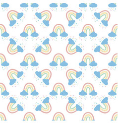 Rainbow with clouds and raindrops seamless pattern